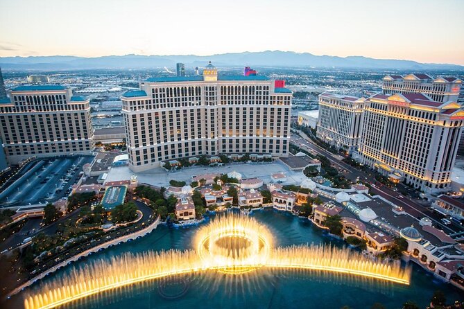 2-Hour Vegas Strip Walking Tour with Photos,Champagne & Vintage Vegas Goody Bags - Key Points