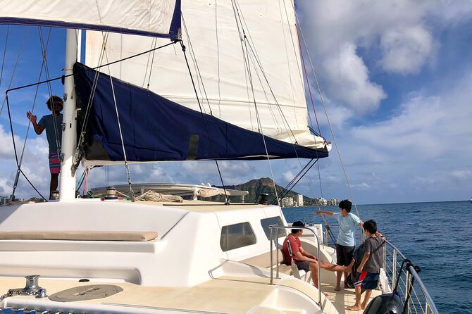 Moanas SwimnSail Cocktail Cruise Along the Waikiki Coast - Return and Overall Atmosphere